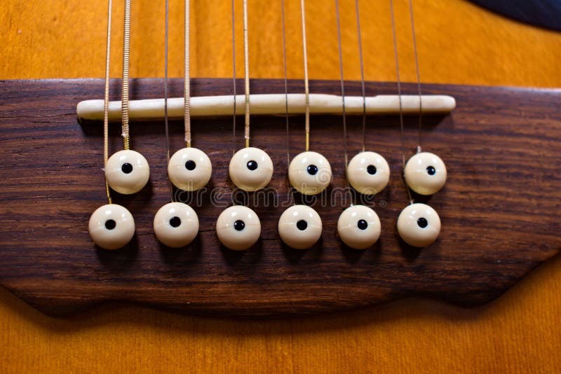The Bridge and Pins of a Twelve String Guitar Stock Photo - Image of ...