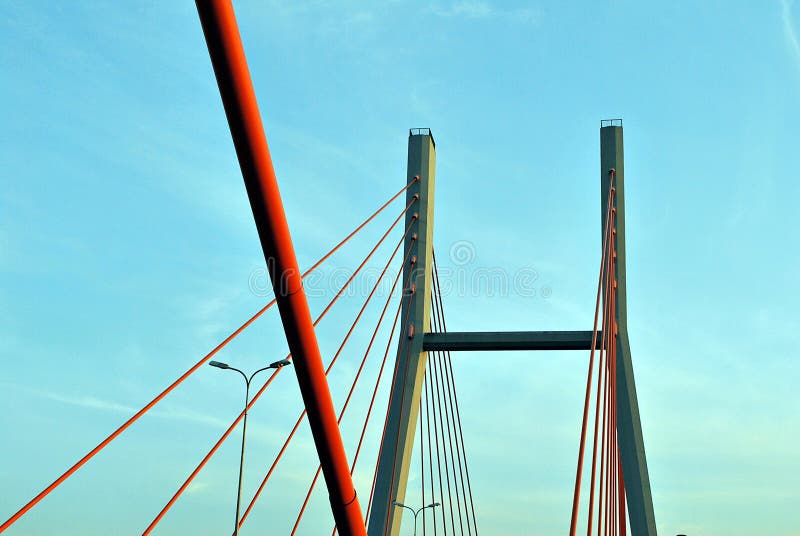 The Bridge Pylons on the Ropes Against the Blue Sky in the Clouds Stock ...