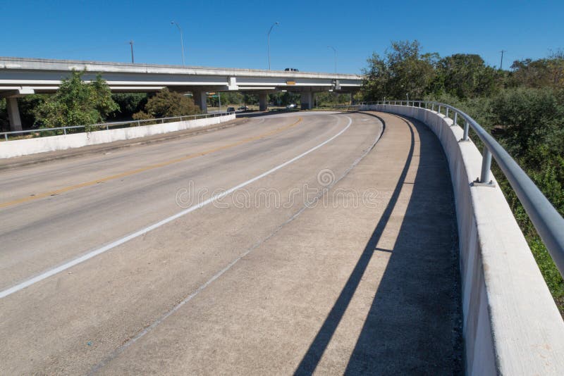 Bridge Railing and a Road Under Another Bridge Stock Photo - Image of ...