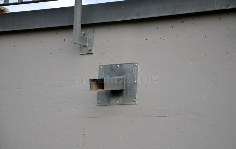A Bridge Railing with Vertical Fence Posts Anchored into the Ground ...