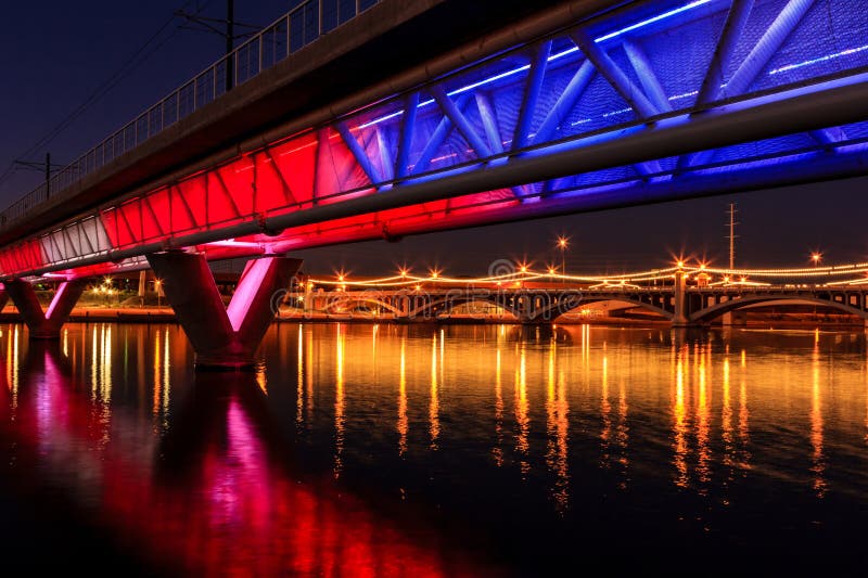 A Bridge with a Red, Blue and White Design is Lit Up at Night Stock ...