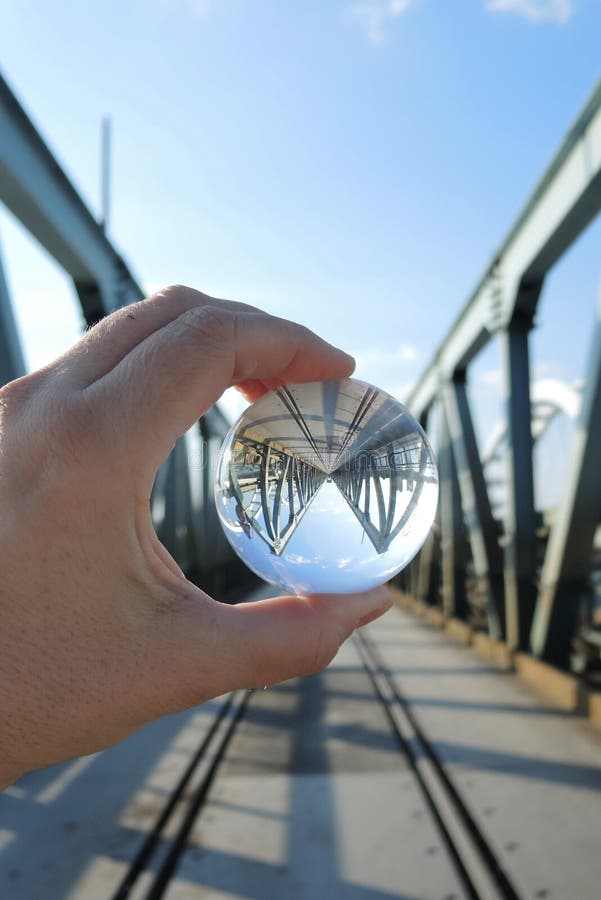 On the Bridge Reflection in Lens Ball Stock Image - Image of reflection ...