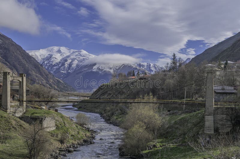 Bridge through the River. Caucasus Mountains, Georgia Stock Photo ...