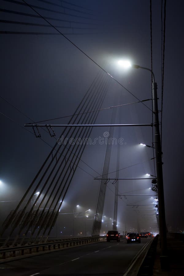 Bridge and Road Lanterns and Trafic in the Mist during Night. Stock ...