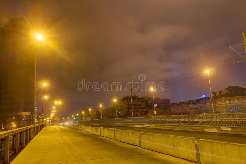 A Bridge and a Road at Night with Shining Lights on Both Sides ...