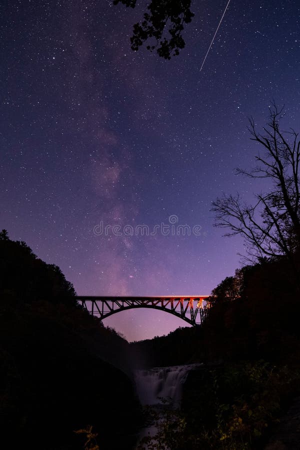 Bridge Silhouetted Against the Majestic Night Sky Featuring a ...
