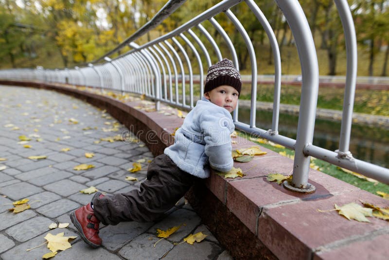 On the Bridge a Small Child Looks Down from the Bridge Stock Image ...