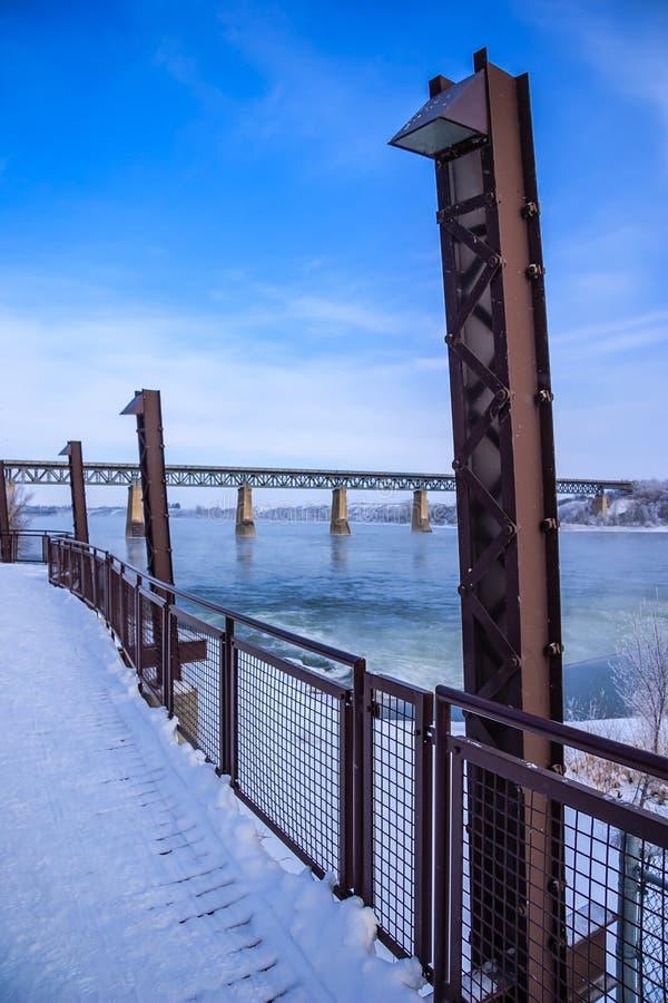 A Bridge Spans a River with a Railing on the Side Stock Photo - Image ...