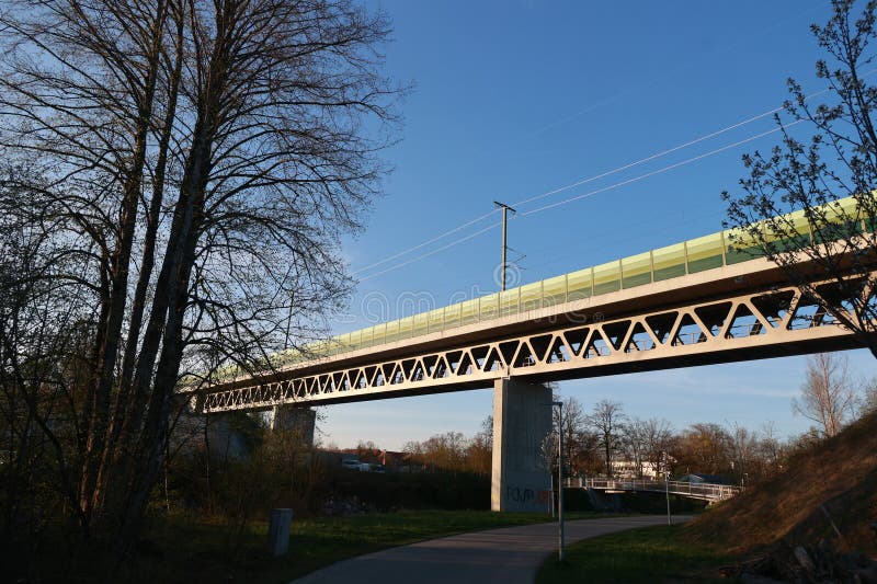 A Bridge Spans a River with a Train Running Underneath it Stock Image ...
