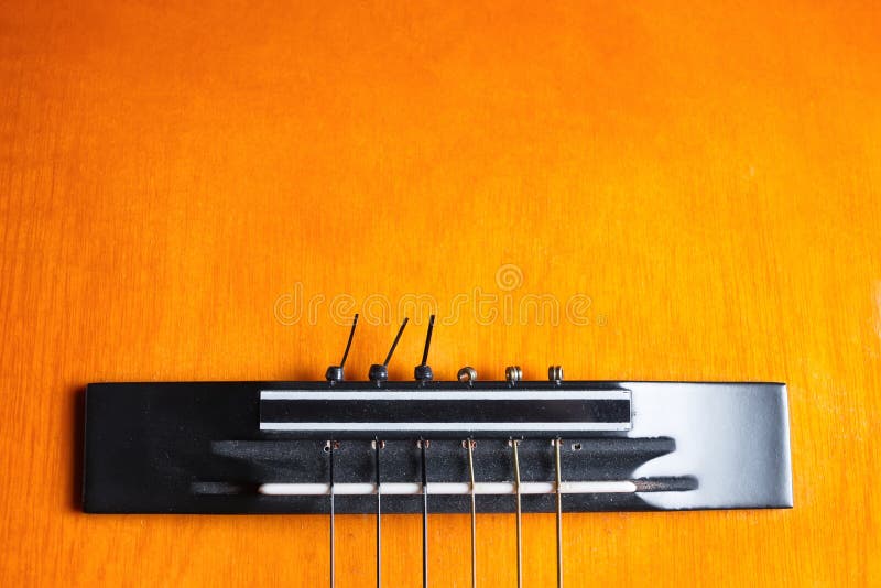 Bridge and Strings of a Yellow and Orange Guitar. Stock Image - Image ...
