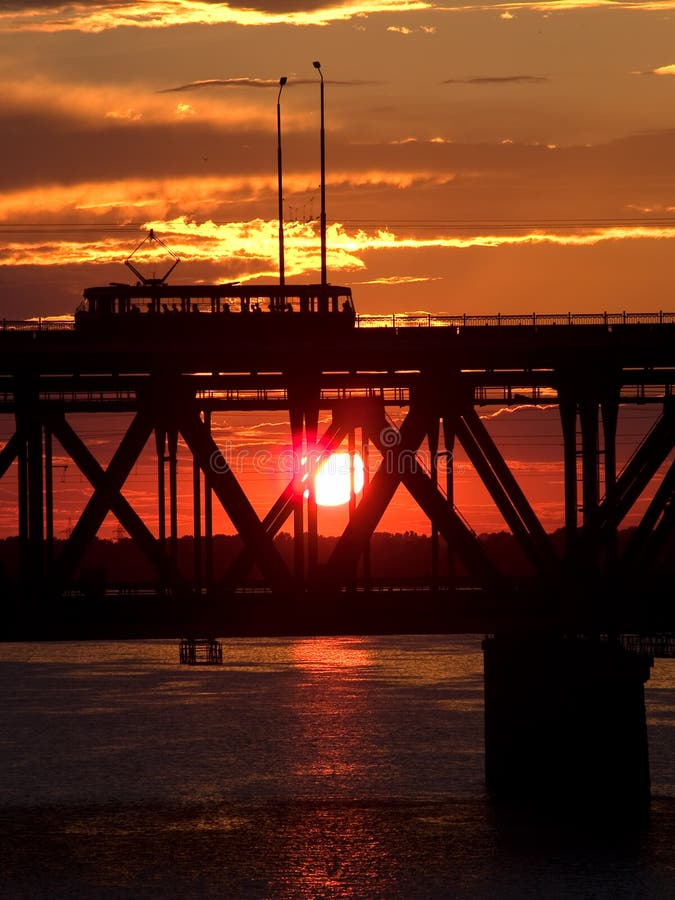 Silhouettes of Couple Running at Beautiful, Early Dawn Under a Bridge ...