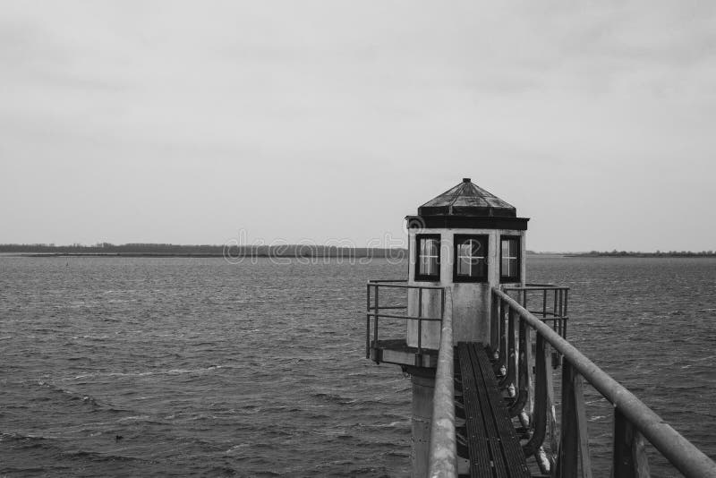Bridge to the lighthouse stock photo. Image of window - 135515454