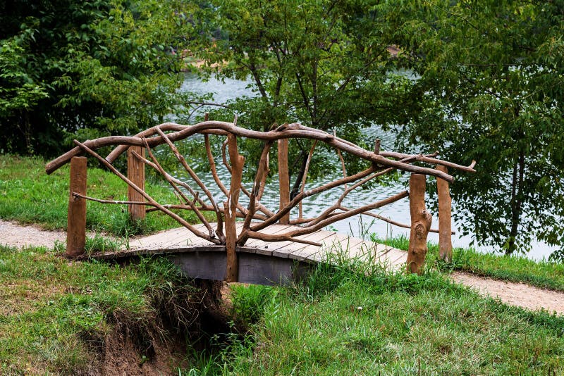 The Bridge from a Tree with a Handrail Stock Photo - Image of grass ...