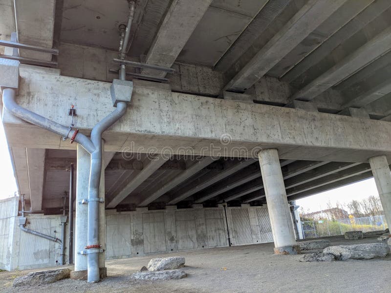 A Bridge from Underneath Reflected in Water. a Dividing Line between ...