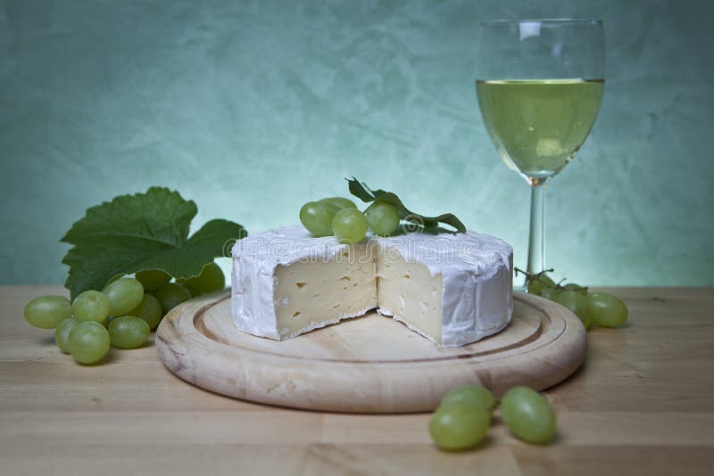Brie,Wine and grapes stock photo. Image of table, appetizer - 25472724