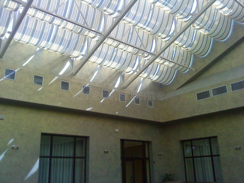 Bright Atrium Interior with a Skylight Ceiling and Soft Sunlight ...