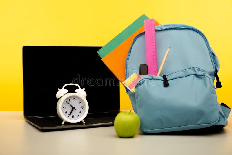 Bright Backpack with Supplies and Laptop on a Table. Online Education ...