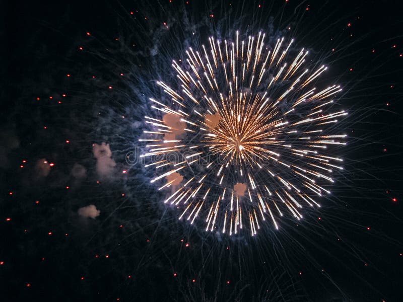 A Bright Ball of Fireworks Exploded into Fiery Splashes in the Dark ...