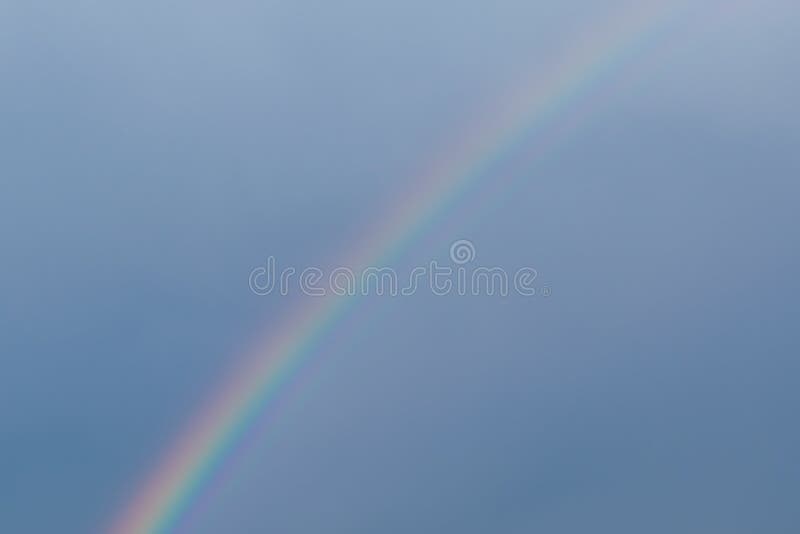 Bright Beautiful Multi-colored Rainbow after a Summer Rain on a Blue ...