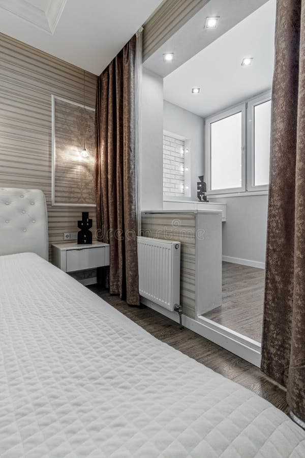 Bright Bedroom with Large White Bed and Capitone Headboard Stock Image ...