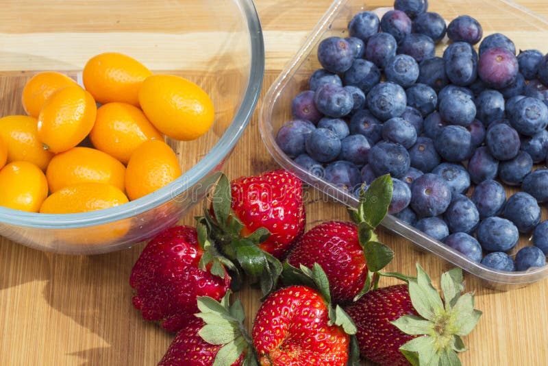 Bright Berries on a Cutting Board in the Kitchen Stock Photo - Image of ...
