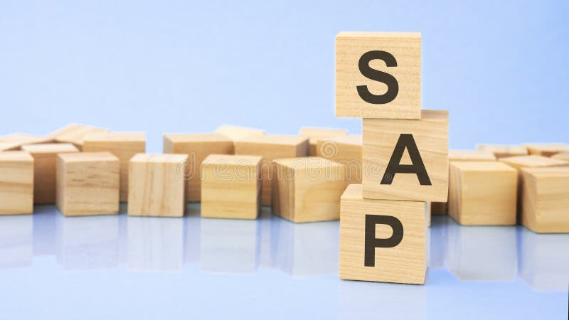 On a Bright Blue Background, Light Wooden Blocks and Cubes with the ...