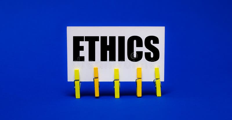 On a Bright Blue Background on Yellow Clothespins, a White Card with ...