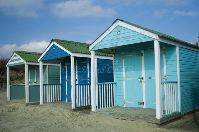 Bright blue beach huts stock image. Image of tourism - 45869735