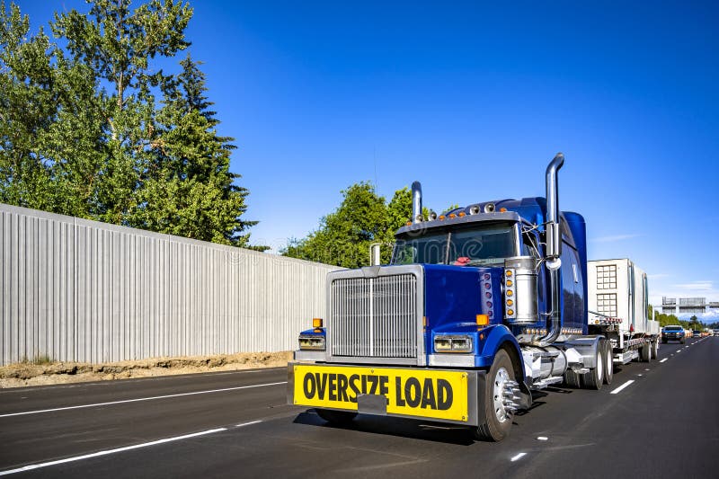 Bright Blue Big Rig Semi Truck with Oversize Load Sigh on the Front ...