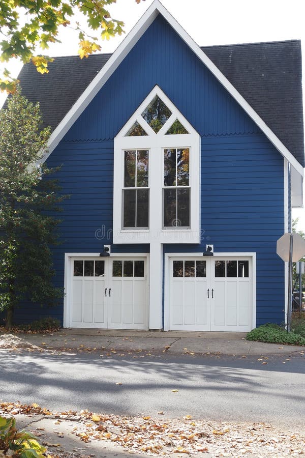 This Bright Blue Building Has a 2 Car Garage. Stock Photo - Image of ...