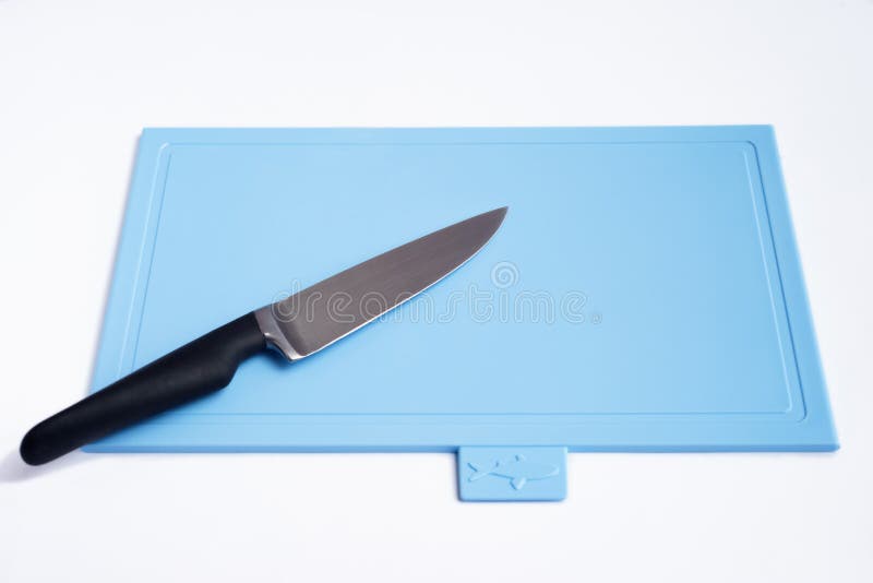 Bright Blue Clean Plastic Cutting Board with a Kitchen Knife on a White ...