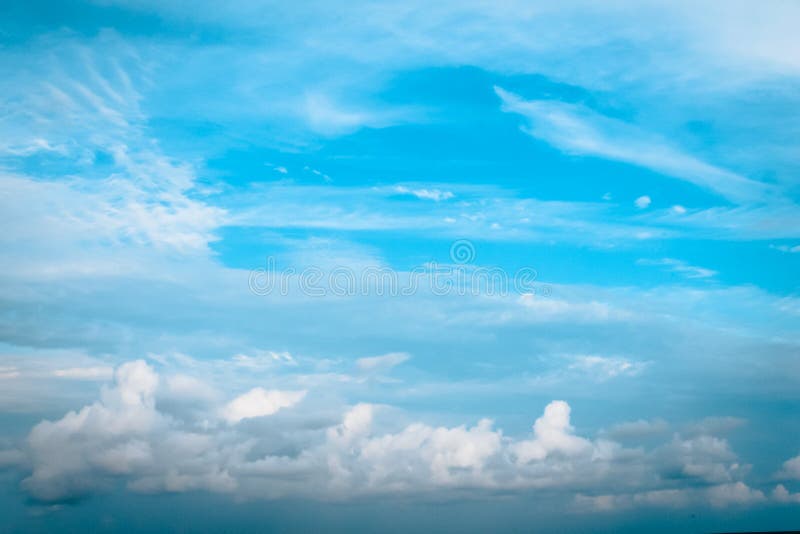 Bright blue cloudy skies stock image. Image of beautiful - 115428933
