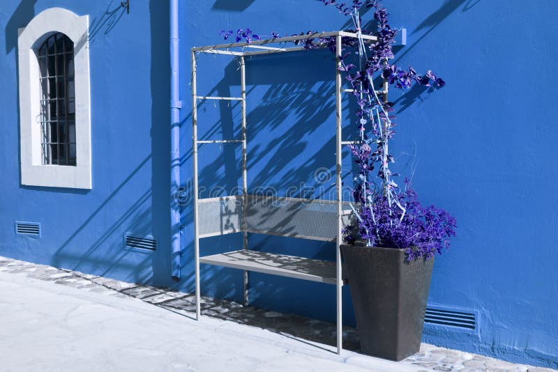 Blue Wall with Bench, Plant and Window Stock Image - Image of sidewalk ...