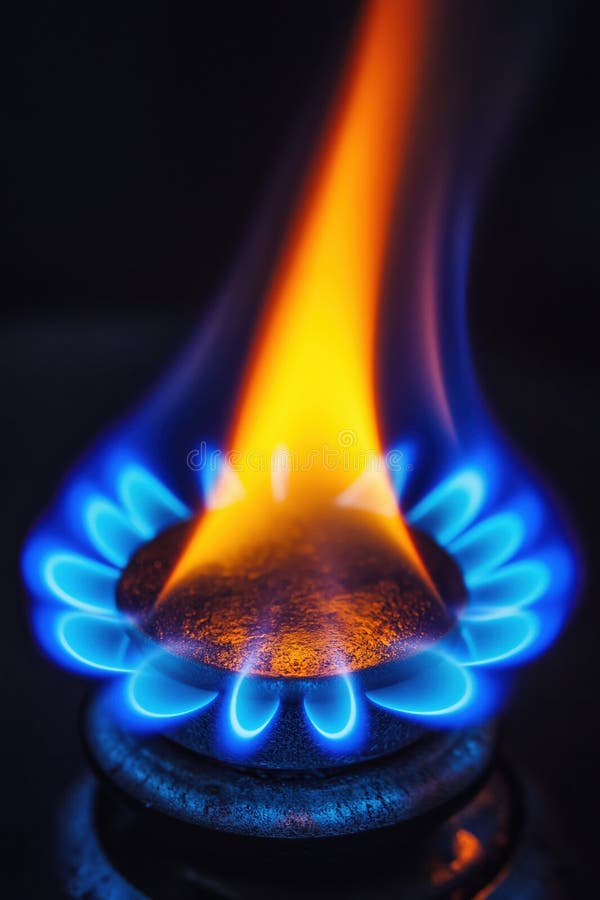 Bright Blue and Orange Flames Emerging from a Gas Burner in a Dark ...