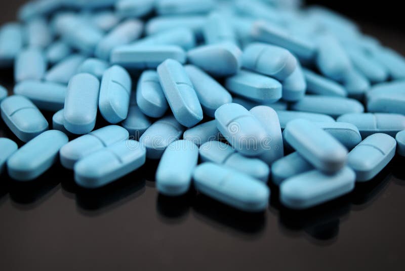 Bright blue oval tablets stock image. Image of natural - 112316181