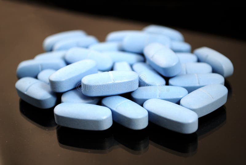 Bright blue oval tablets stock image. Image of oval - 112383543