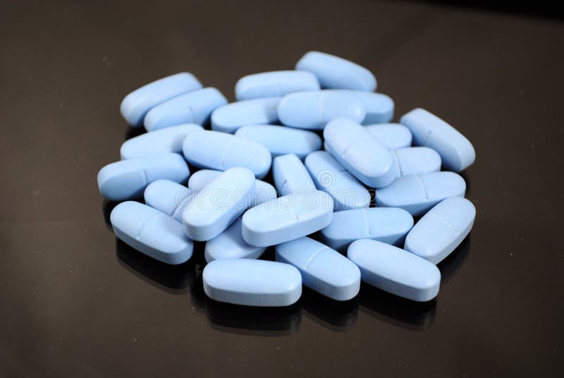 Bright Blue Round Pills on White Background Stock Image - Image of ...