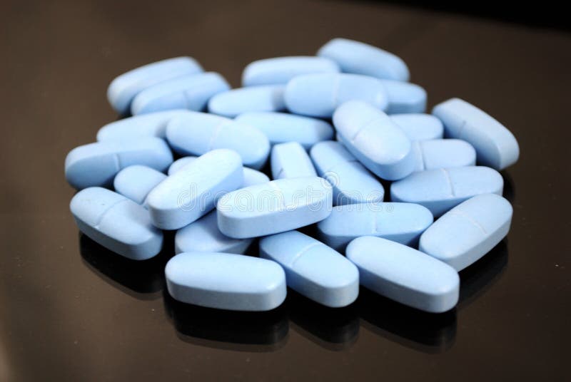 Blue oval tablets stock photo. Image of medication, natural - 109404534