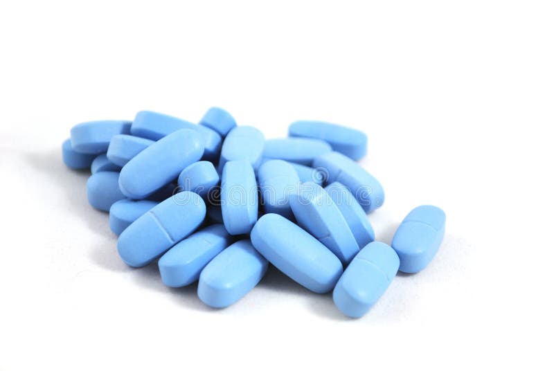 Bright blue oval tablets stock photo. Image of dose - 112383538