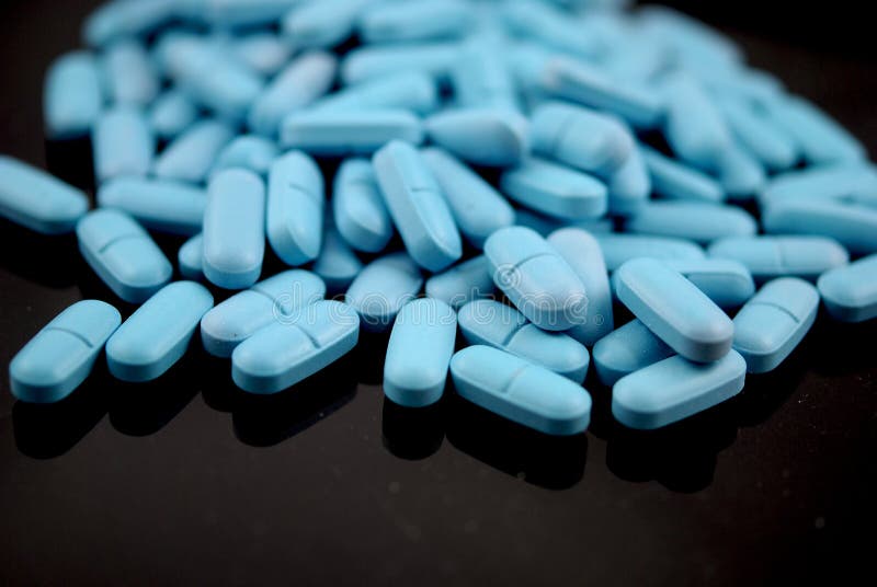 Bright Blue Oval Tablets Isolated Stock Photo - Image of headache ...