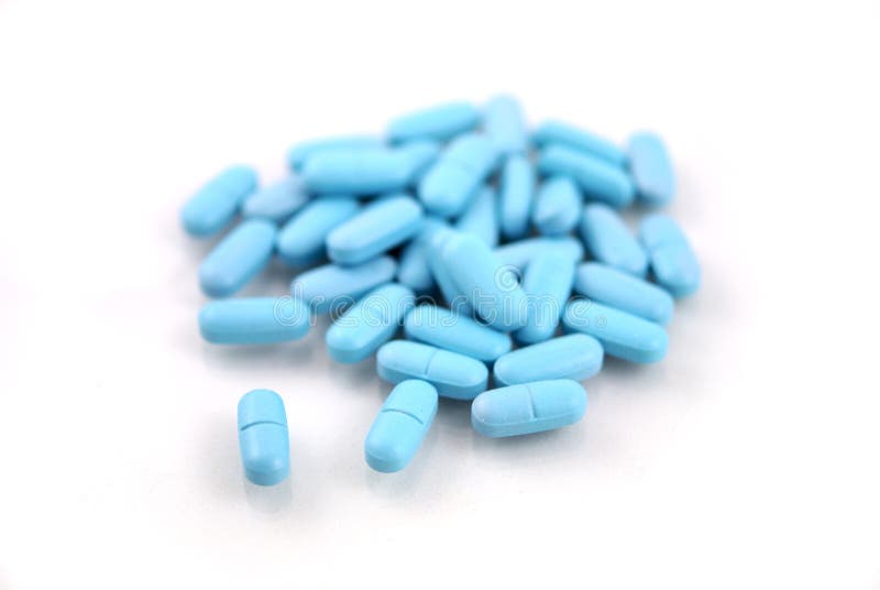 Bright Blue Oval Tablets Isolated Stock Photo - Image of closeup ...