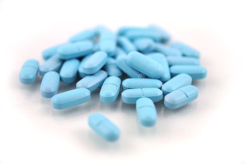 Bright Blue Oval Tablets Isolated Stock Photo - Image of medical, drug ...