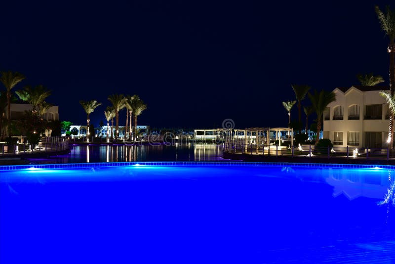 Bright Blue Pool by the Sea in the Hotel at Night Stock Image - Image ...