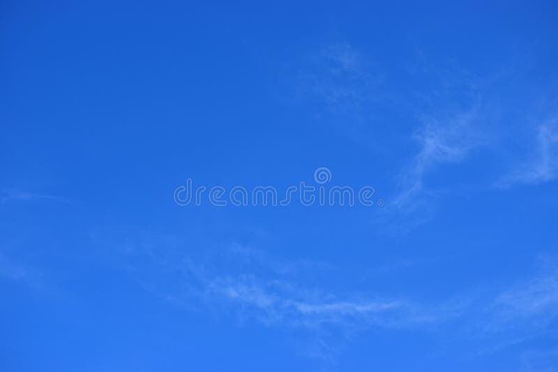 A Bright Blue Sky with a Few Clouds for Use As a Background or Backdrop ...