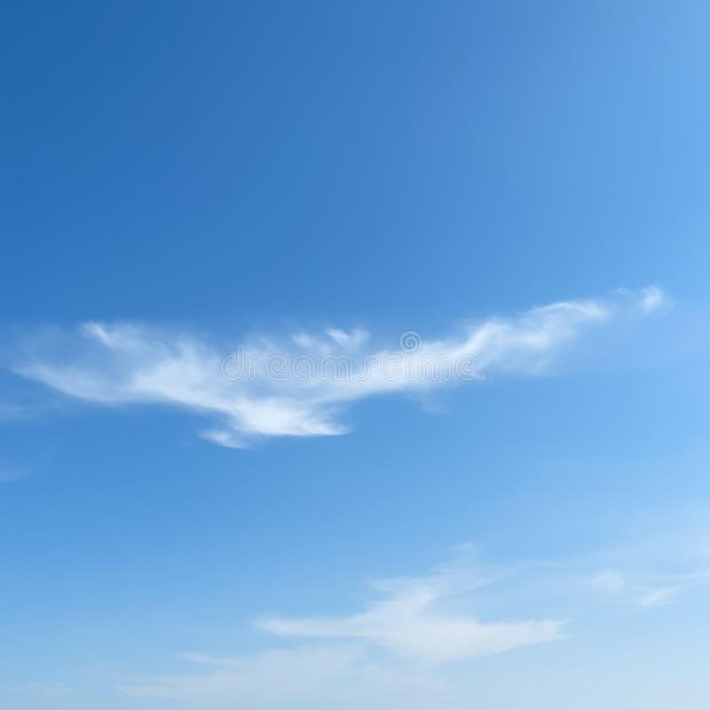 A Bright Blue Sky with a Light Breeze Moving the Clouds Across the ...