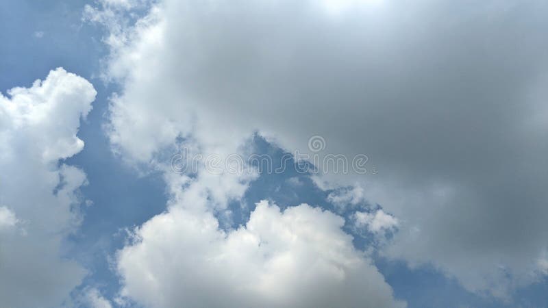 A Bright Blue Sky Partially Obscured by Fluffy White Clouds. the Clouds ...
