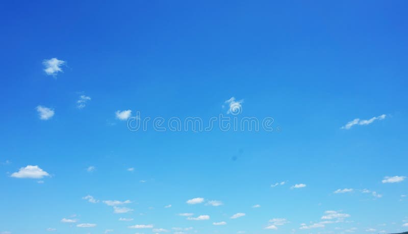 A Bright Blue Sky with a Small Point of a Flying Airplane Stock Image ...