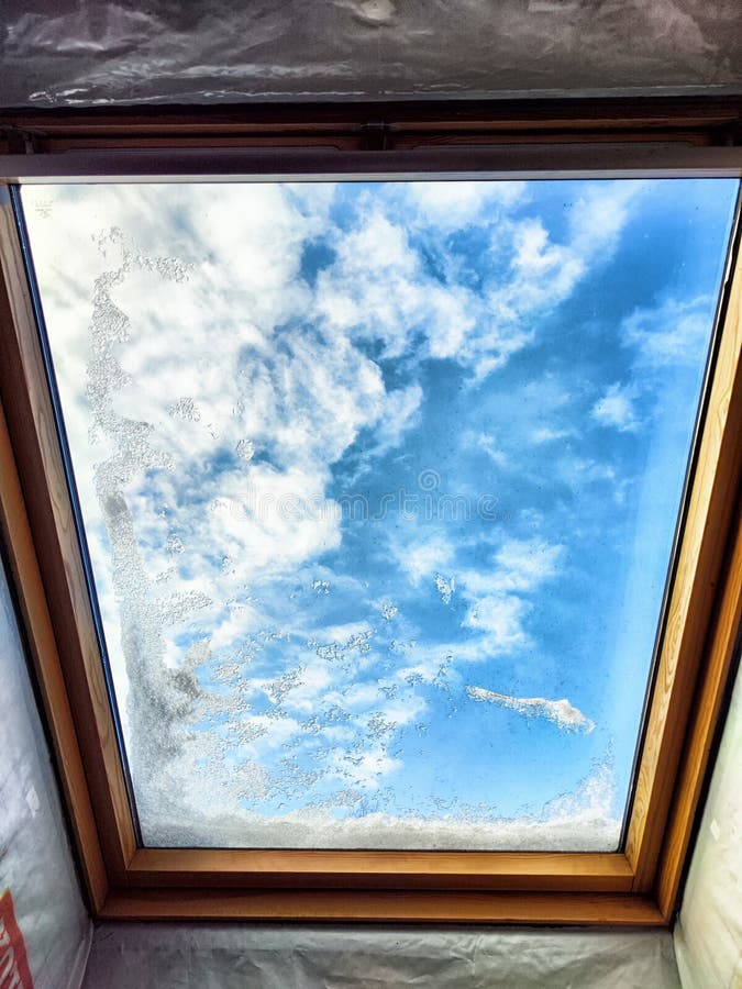 Bright Blue Sky Viewed through a Skylight Surrounded by Wooden Frames ...