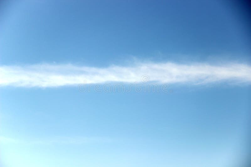 Bright Blue Sky with a White Wide Strip of Feather Clouds. Bright Blue ...