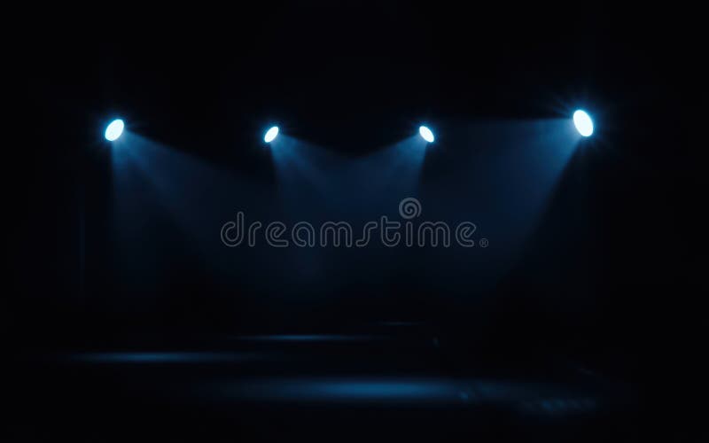 Bright Blue Stage Lights Illuminate a Dark Performance Space for a ...